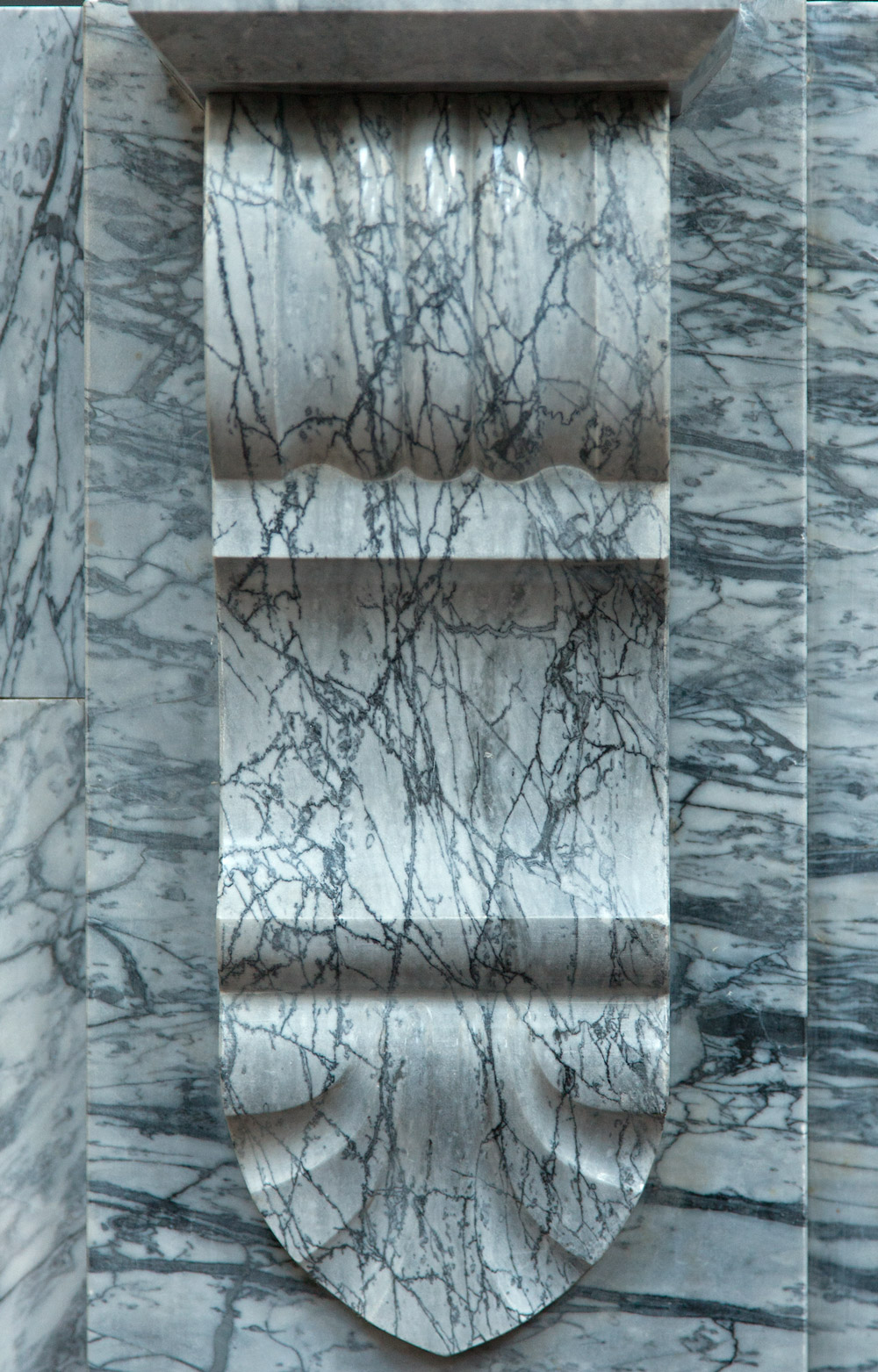 Striated dove marble surround